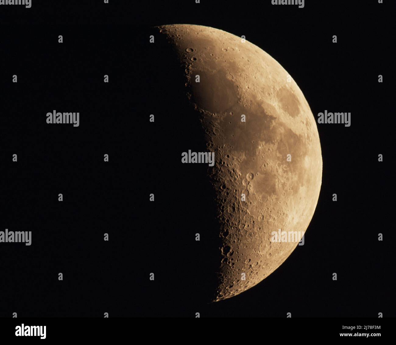 Photograph of Moon in the first quarter lunar phase Stock Photo - Alamy