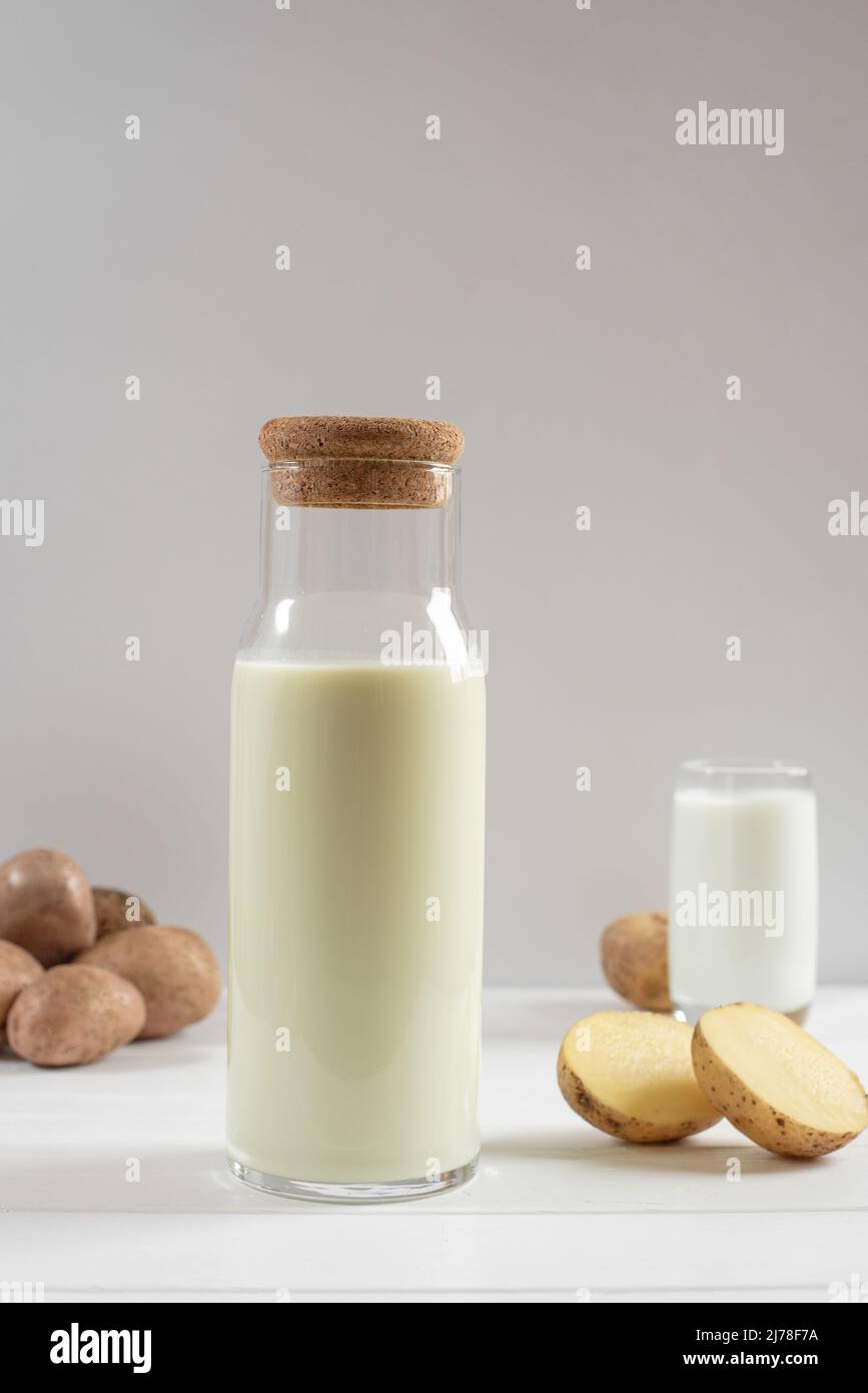 potato milk bottle on a light background Stock Photo - Alamy