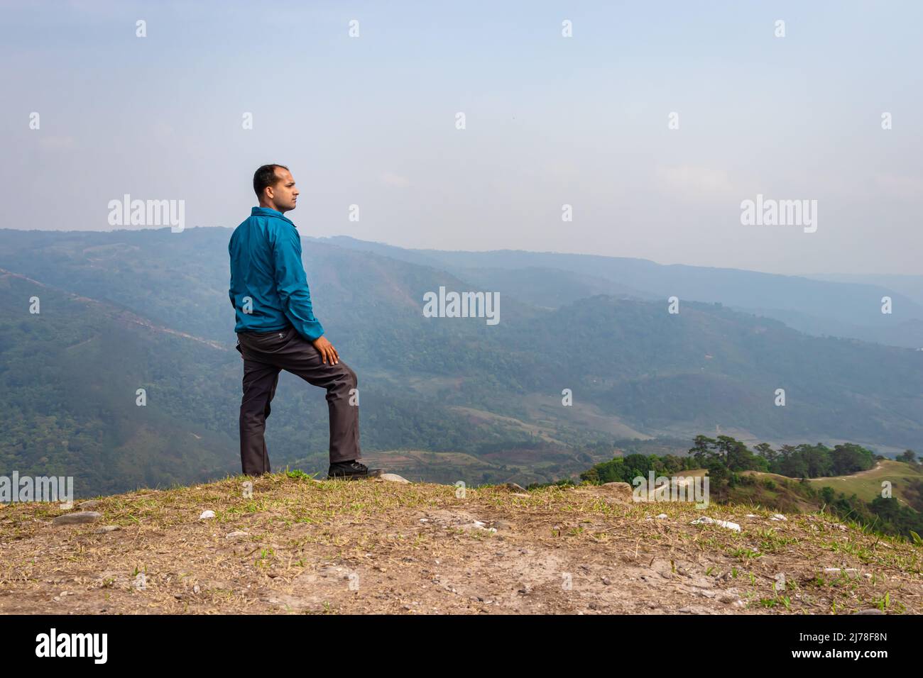 Person Standing Alone On Mountain