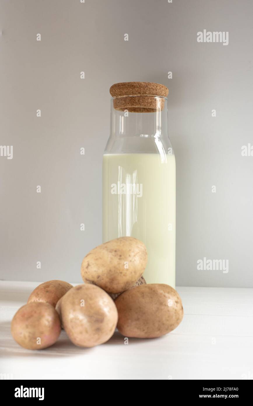 potato milk bottle on a light background Stock Photo - Alamy