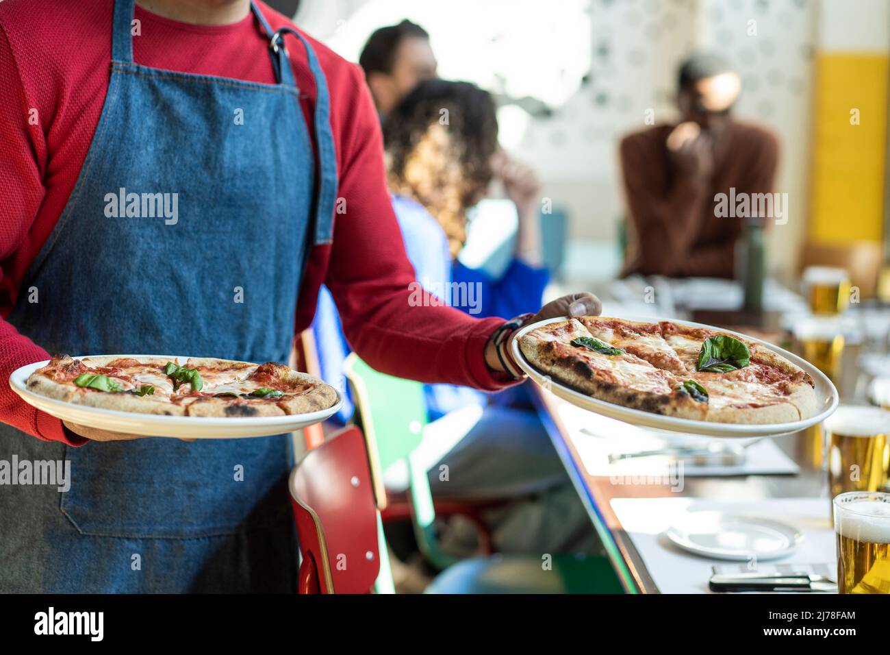 Chinese waiter serving food hi-res stock photography and images - Alamy