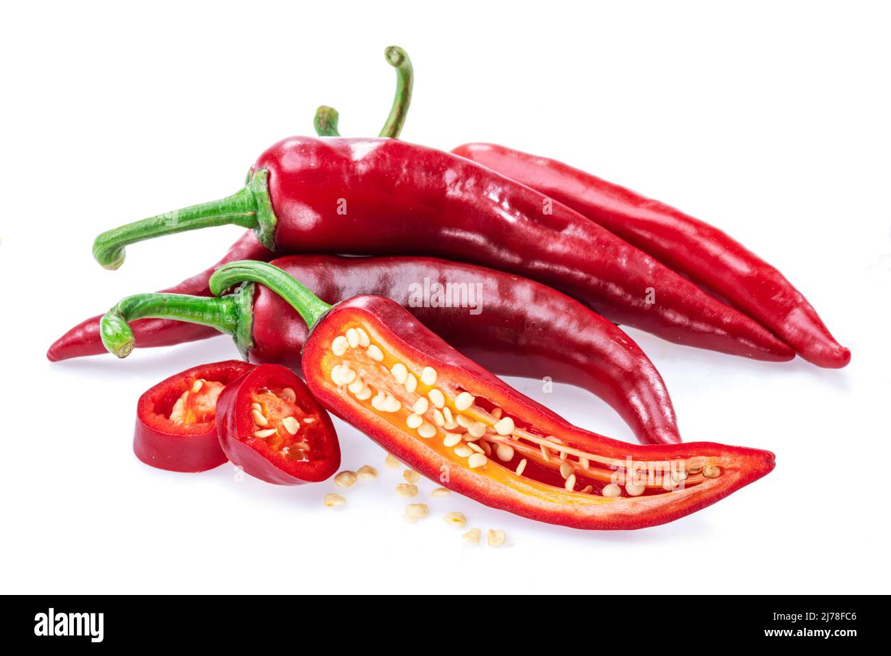 Fresh red chilli peppers and cross section of chilli pepper with seeds ...