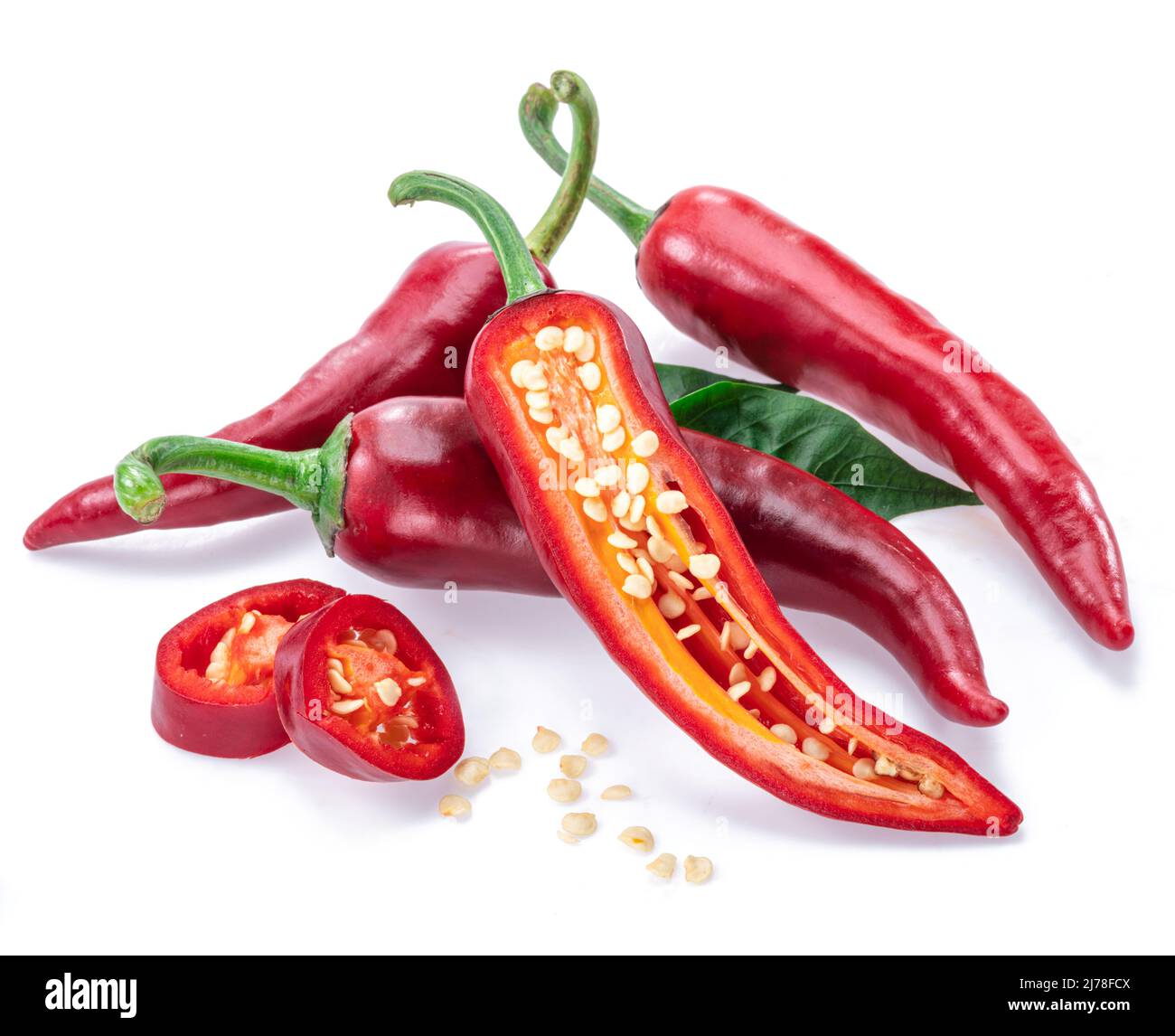 Fresh red chilli pepper and cross sections of chilli pepper with seeds ...