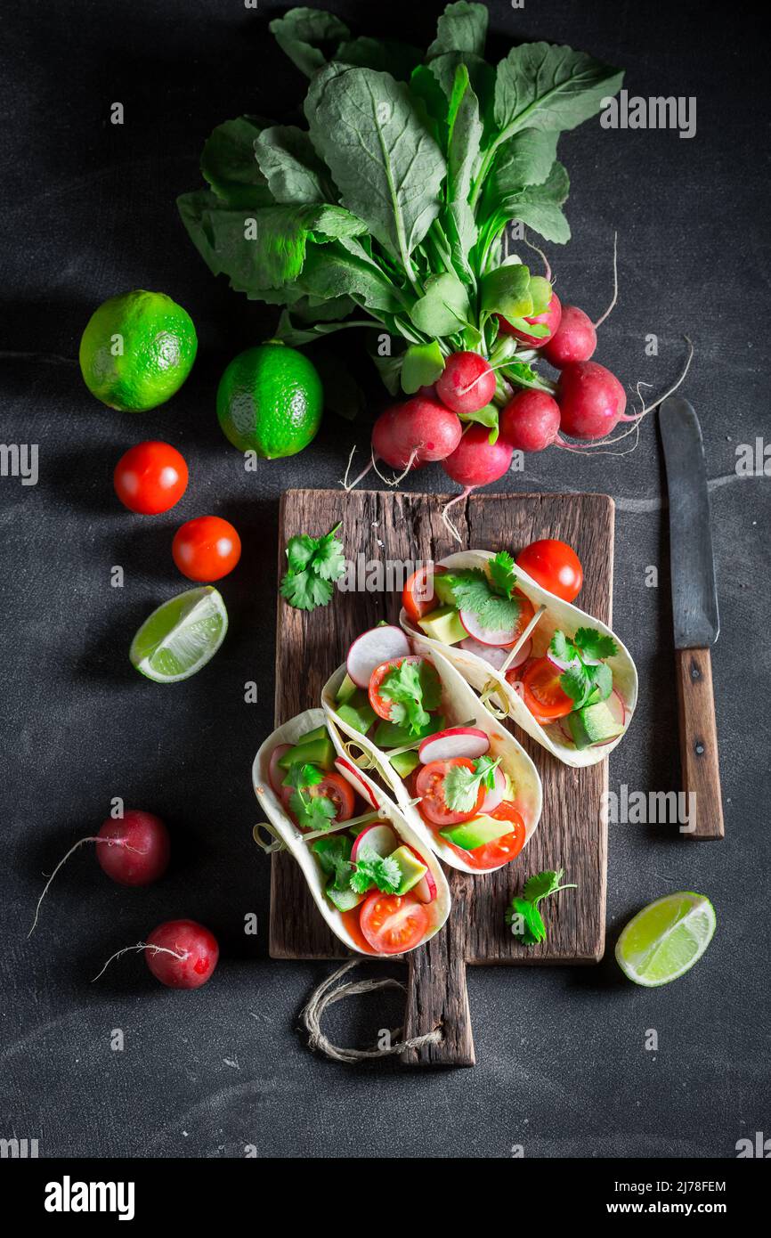 Mexican and spicy tacos with tomatoes, radish and coriander. Tacos with ...
