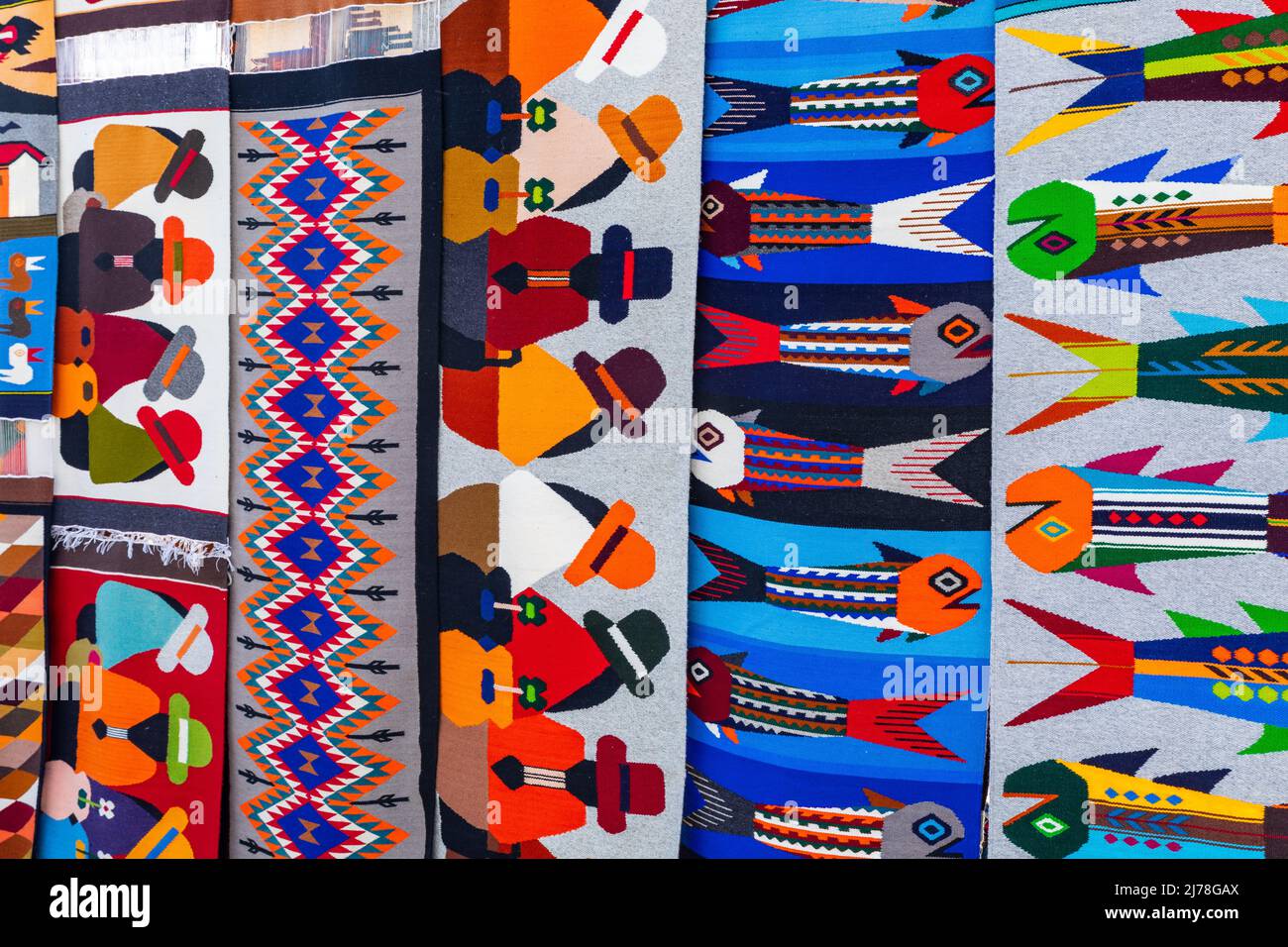 A pile of colorful Andean fabric textiles on the local market in ...