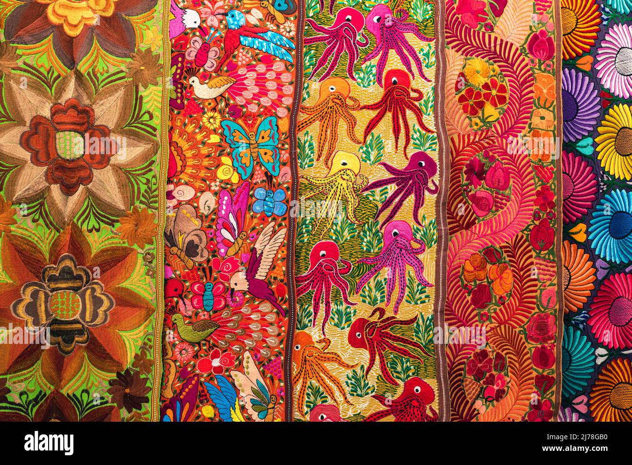 A pile of colorful Andean fabric textiles on the local market in ...