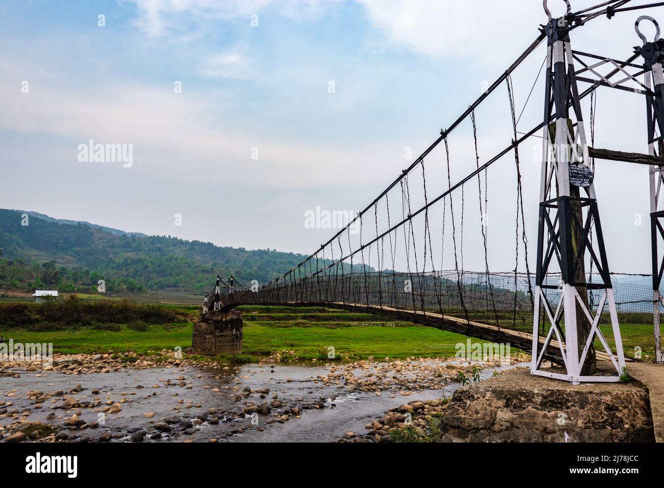 isolated iron suspension bridge old with misty mountain background at ...