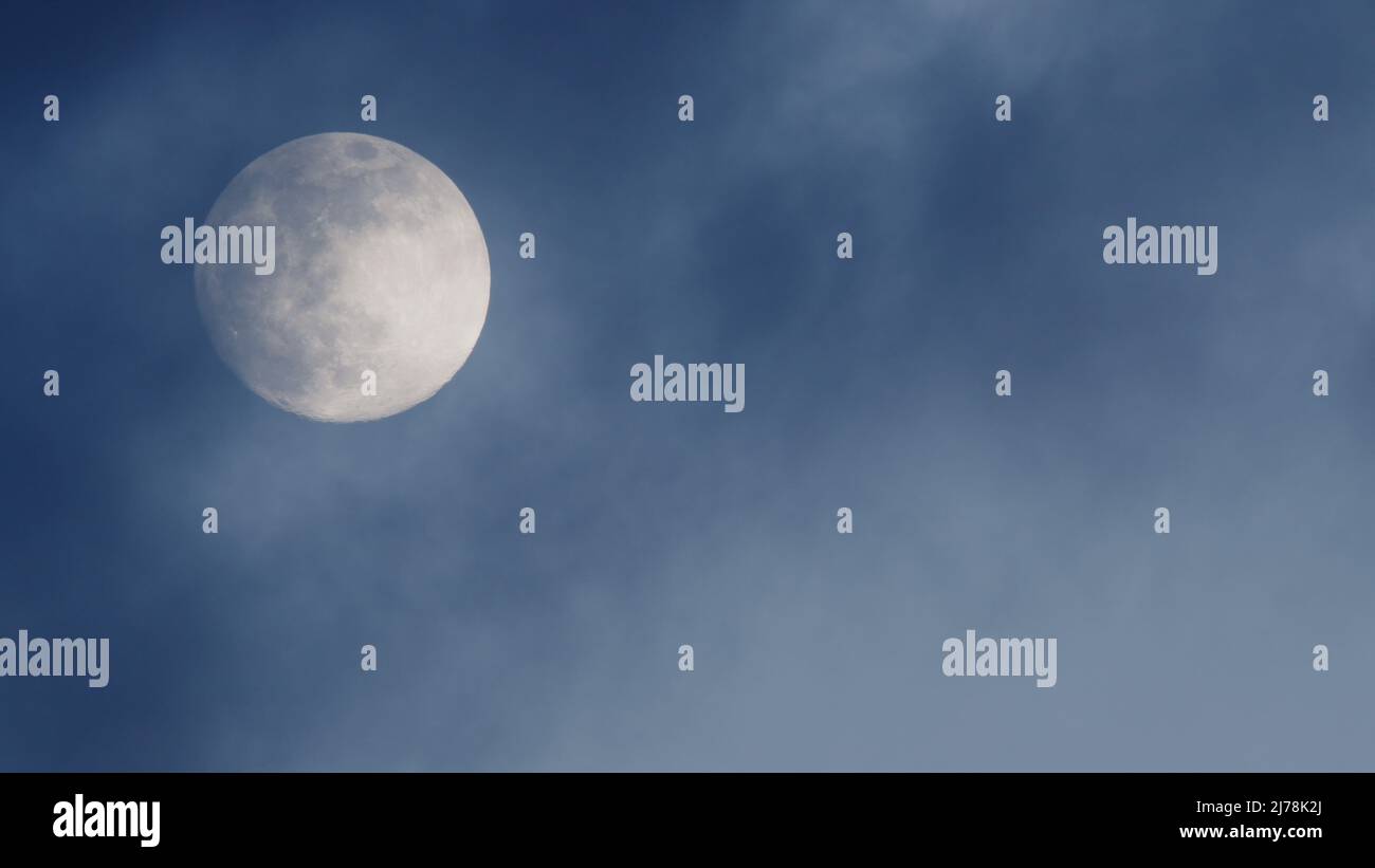 Photograph of Full Moon in the clear sky Stock Photo - Alamy