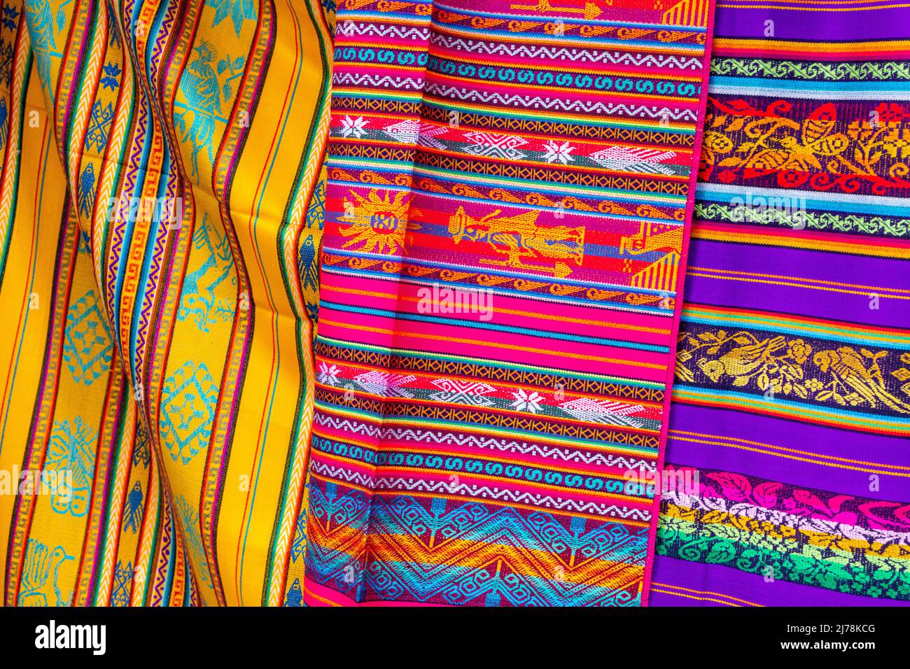 Colorful Andean fabric textiles on the local souvenir market in Otavalo ...