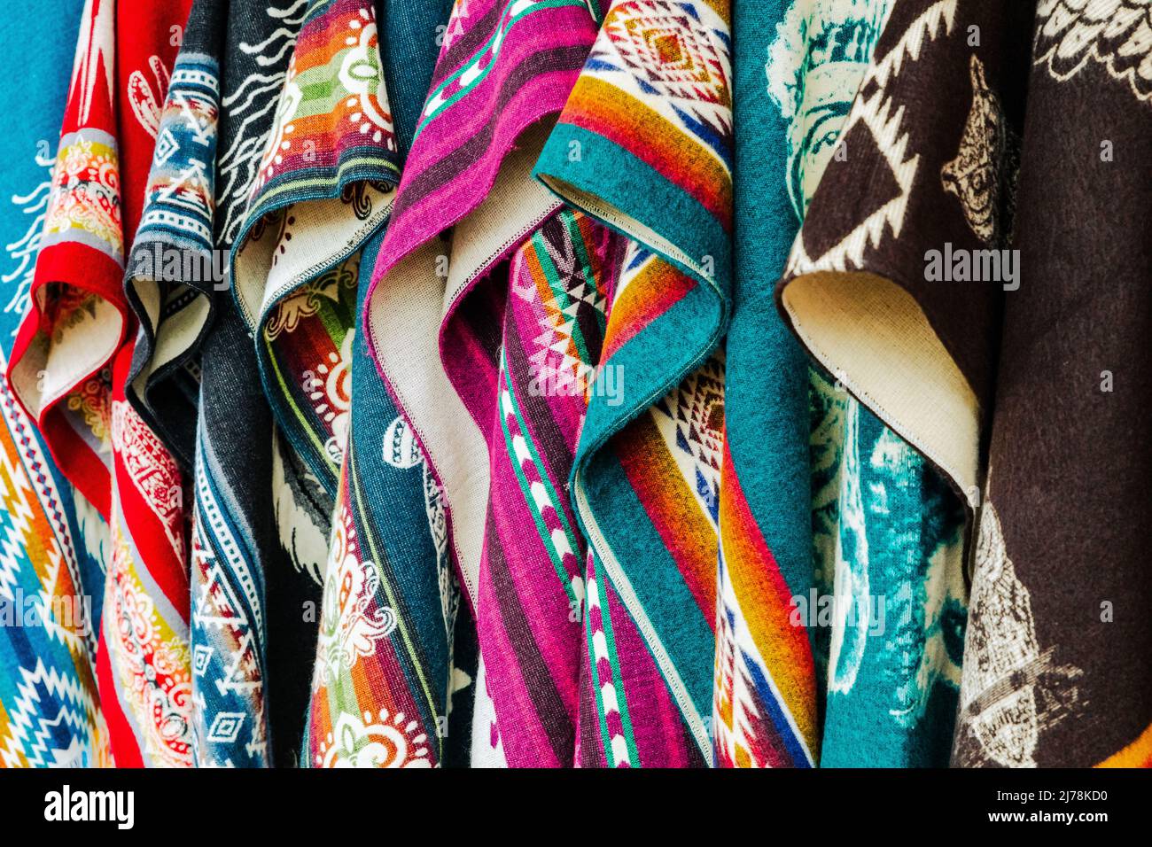 Colorful Andean fabric textiles on the local souvenir market in Otavalo ...