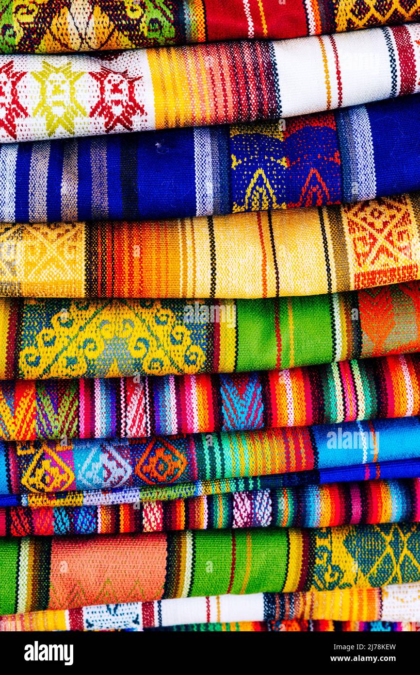 Colorful Andean fabric textiles on the local souvenir market in Otavalo ...