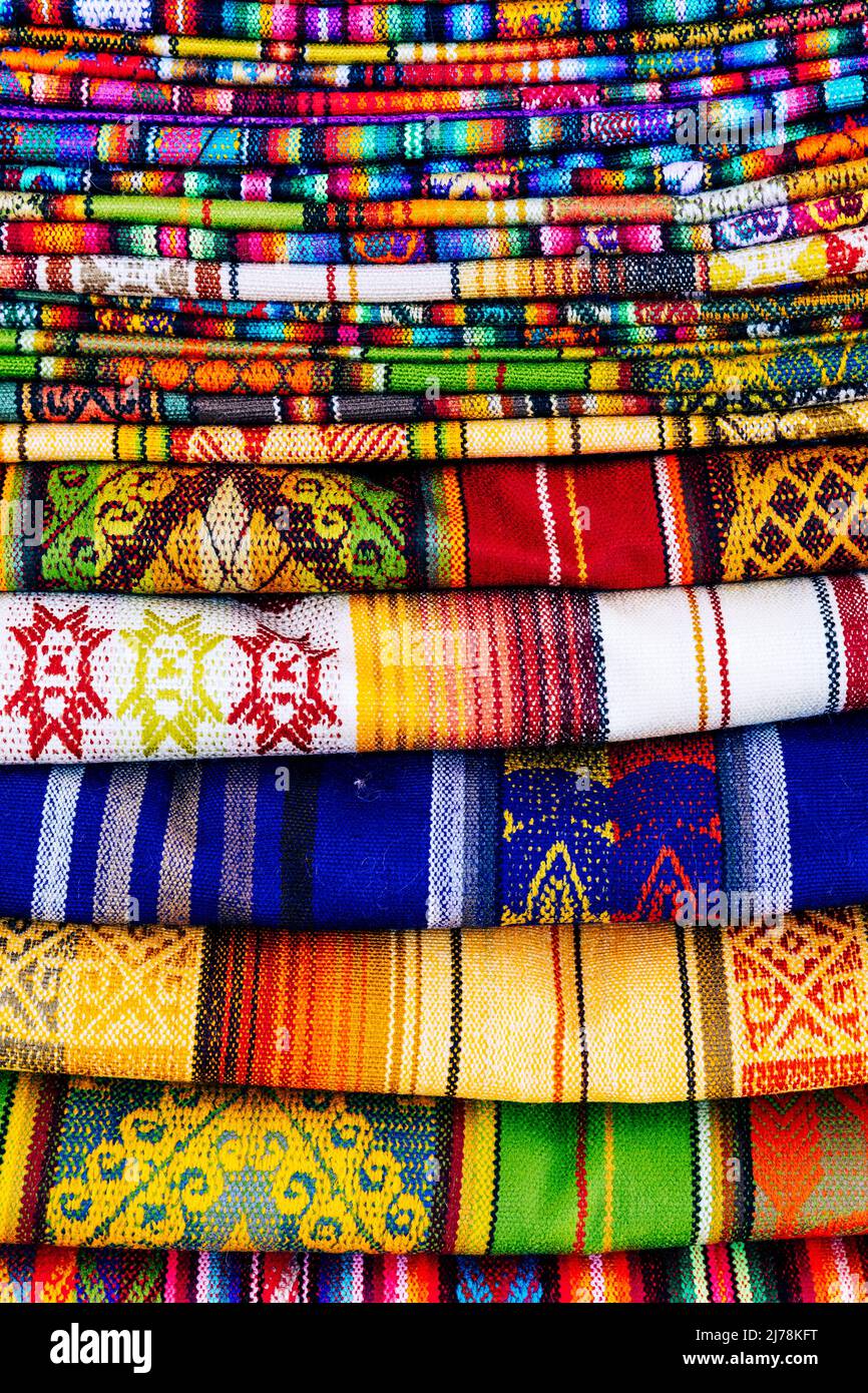 Colorful Andean fabric textiles on the local souvenir market in Otavalo ...