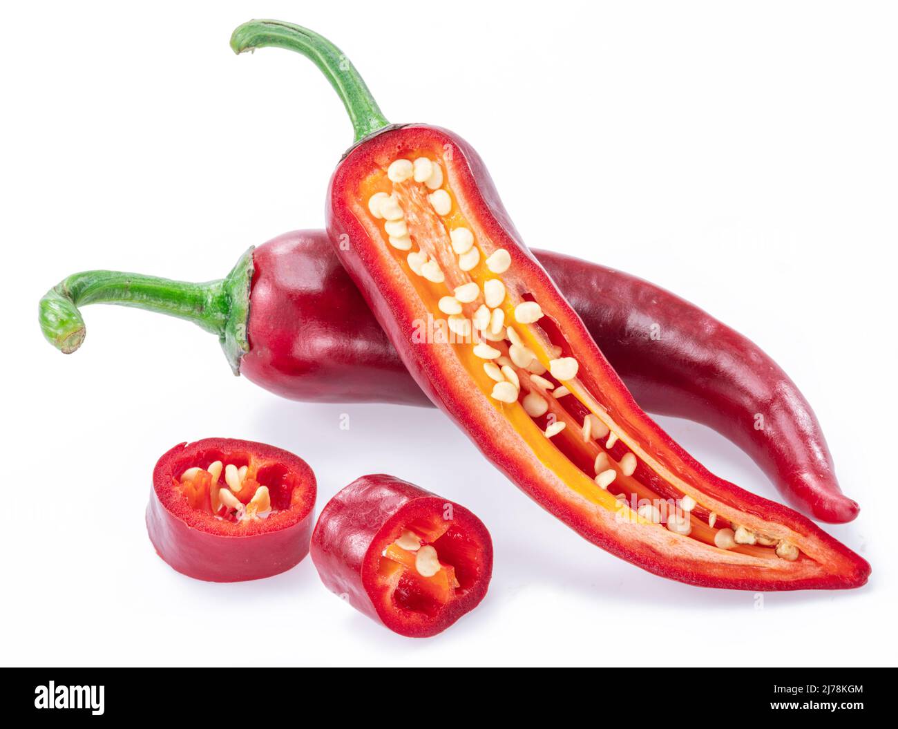 Fresh red chilli pepper and cross sections of chilli pepper with seeds ...