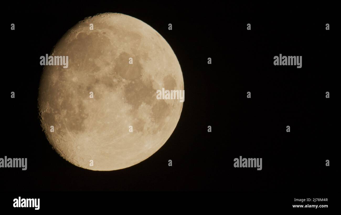 Photograph of Moon in the first quarter lunar phase Stock Photo - Alamy
