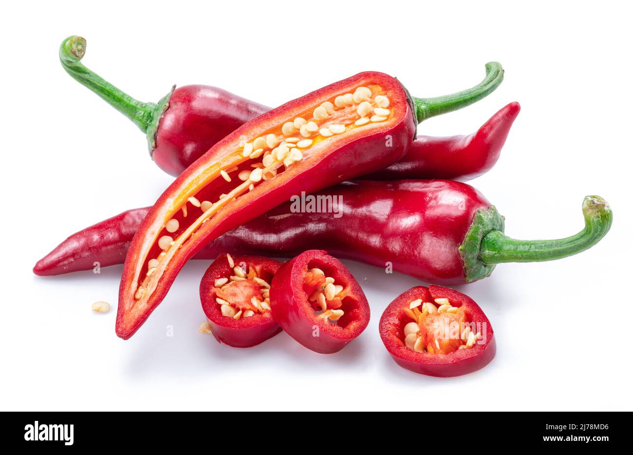 Fresh red chilli pepper and cross sections of chilli pepper with seeds ...