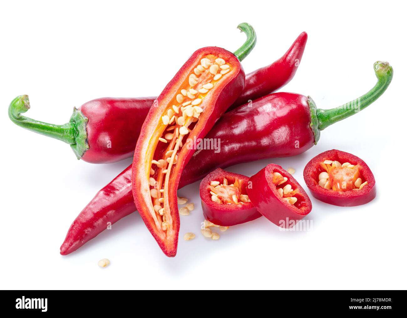 Fresh red chilli pepper and cross sections of chilli pepper with seeds ...