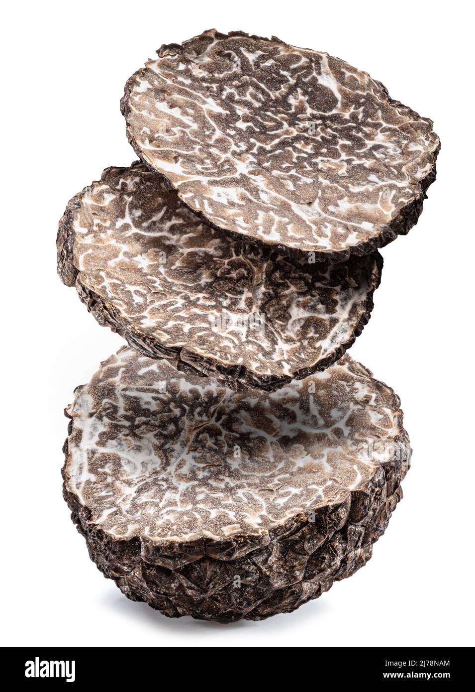 Slices of black winter truffle on white background. The most famous of ...