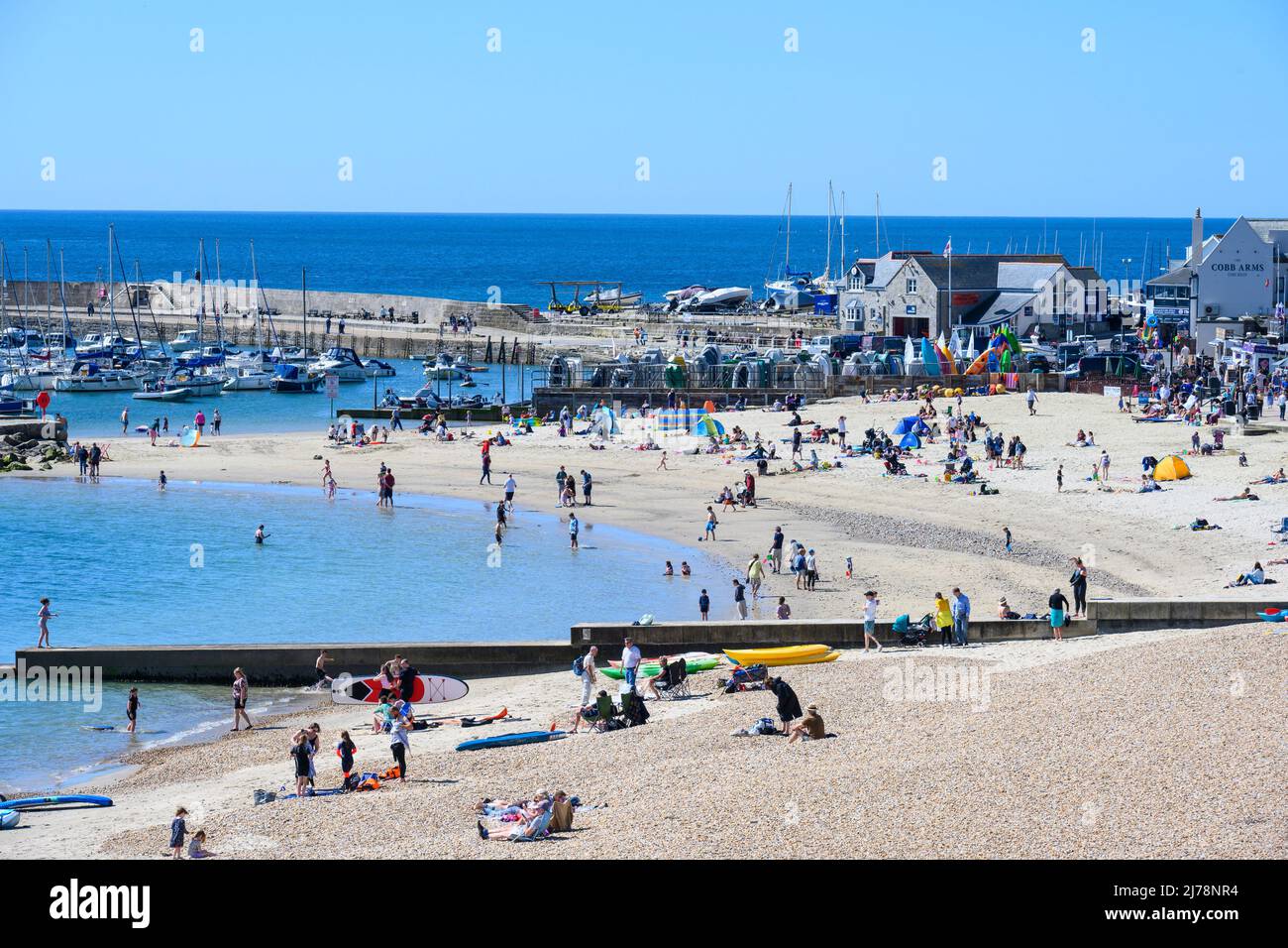 Lyme Regis, Dorset, UK. 7th May 2022. UK Weather: People flock to the ...