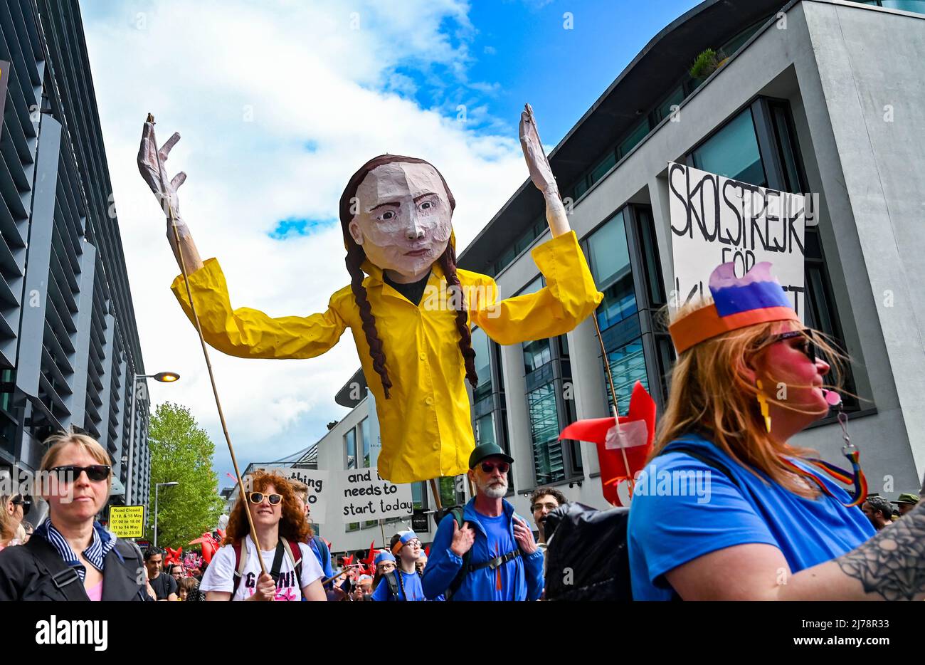 Brighton UK 7th May 2022 - A giant puppet of Greta Thunberg is carried ...