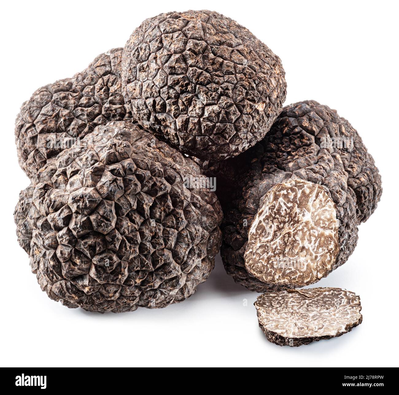 Black edible winter truffles on white background. The most famous of ...