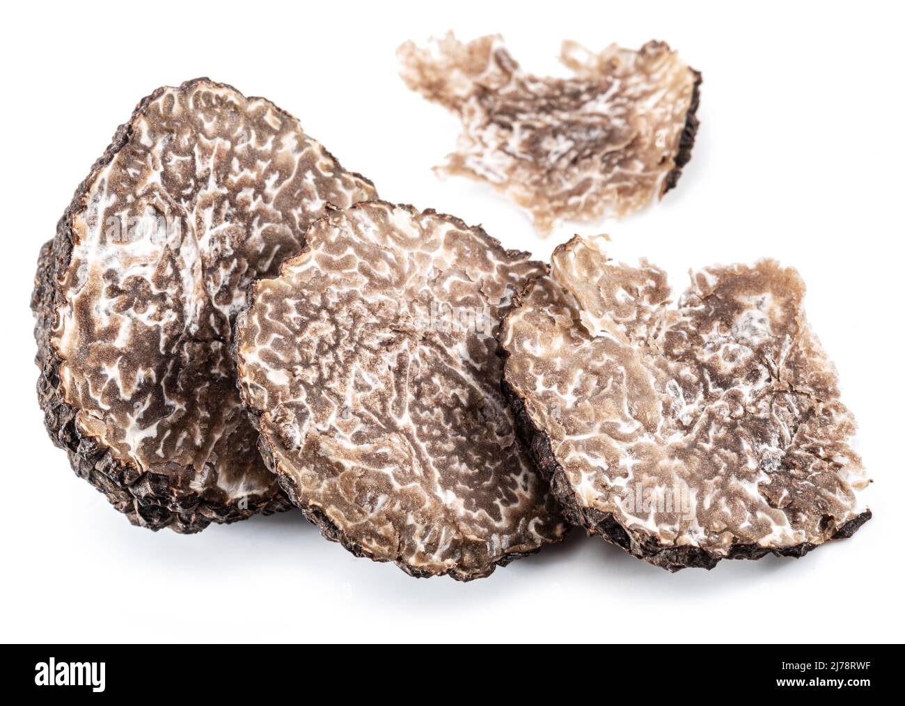Black winter truffle slices on white background. The most famous of the ...