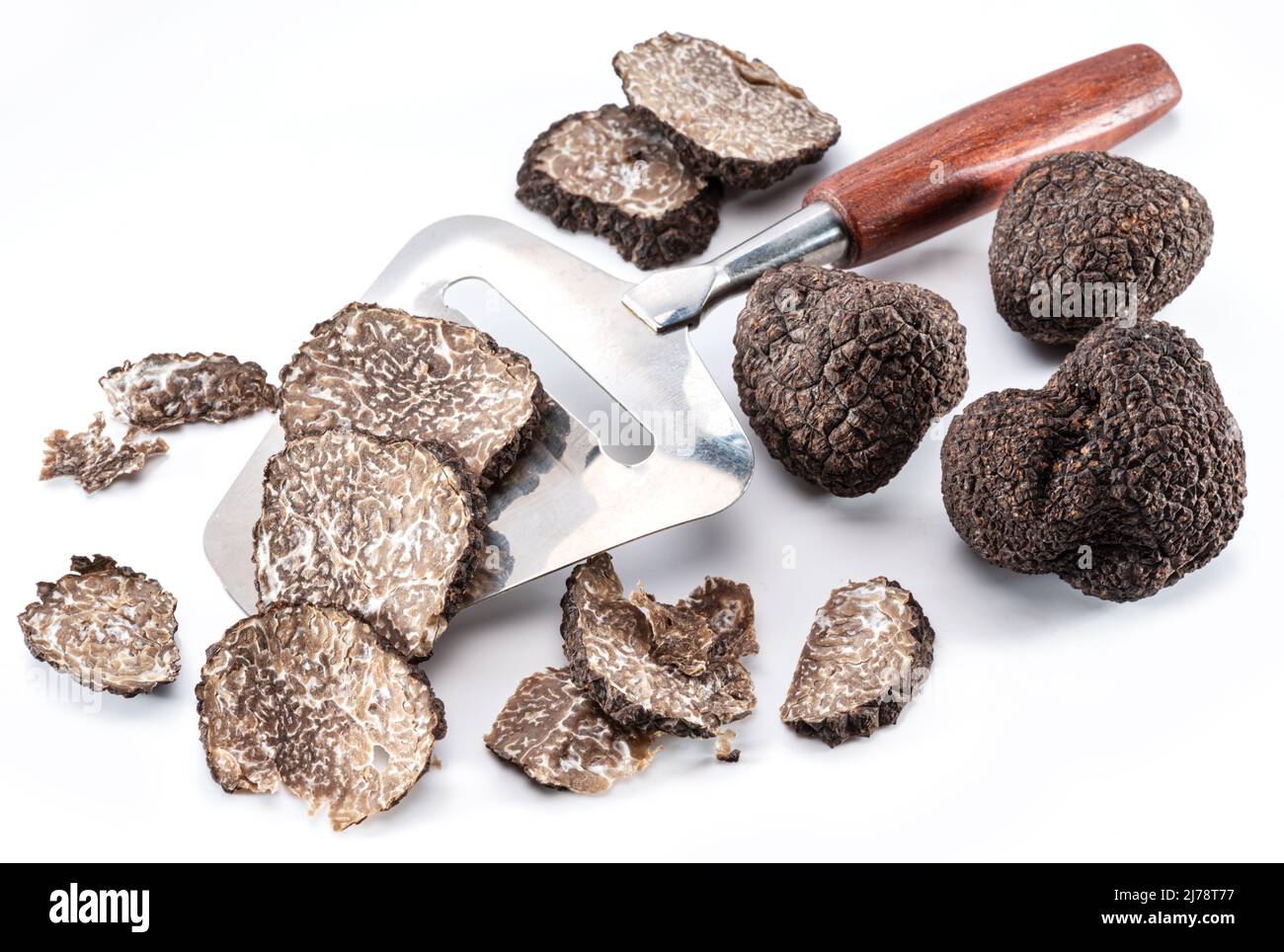 Black edible winter truffle on white background. The most famous of the ...