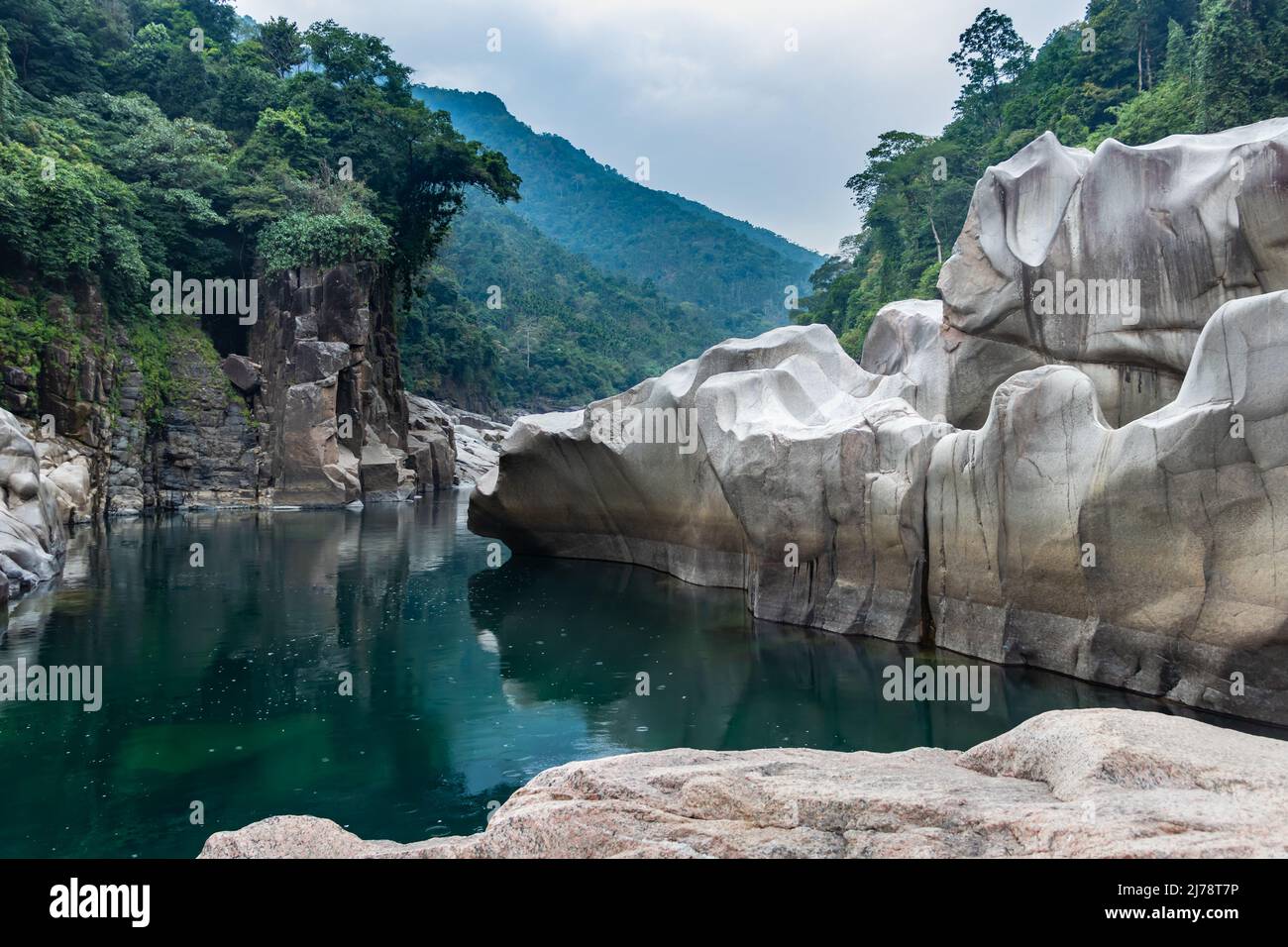 river water with naturally formed white shiny stone in unique shape at ...