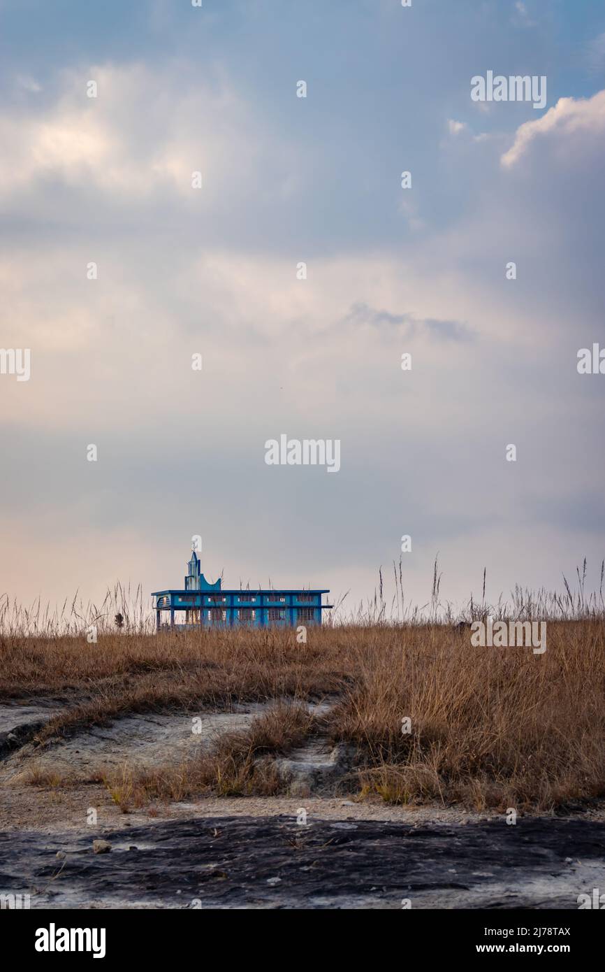 isolated church at yellow grass field with dramatic sky at morning from ...