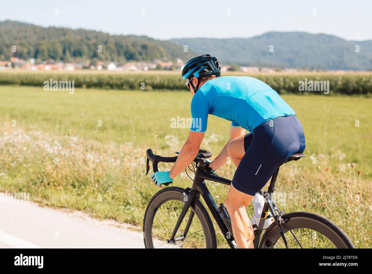 Muscular man, professional racing bicyclist sprint cycling, with ...