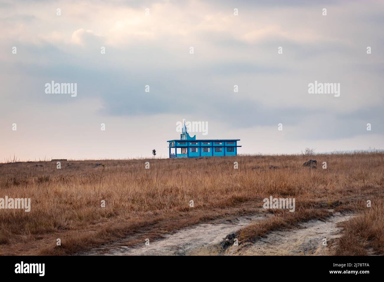isolated church at yellow grass field with dramatic sky at morning from ...