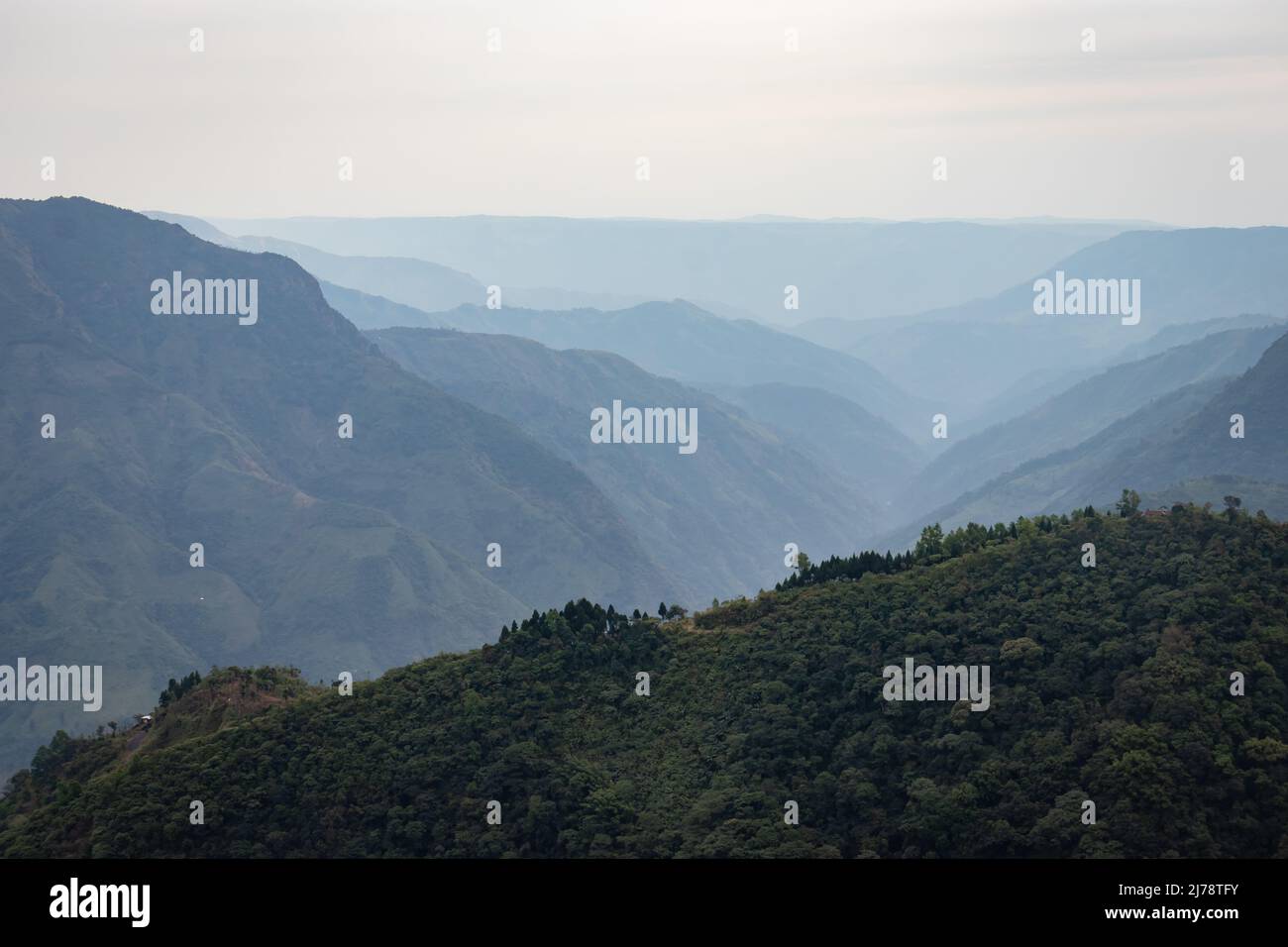 mountain valley covered with white mists and haze at morning from flat ...