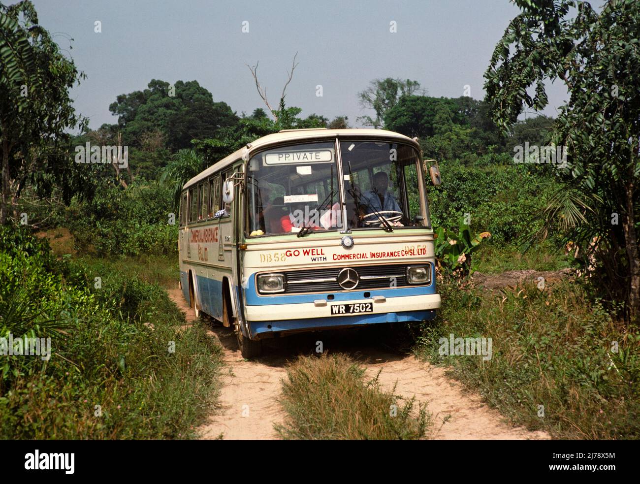 Mercedes Benz coach tour bus driving on rural unsurfaced road to Vaama ...