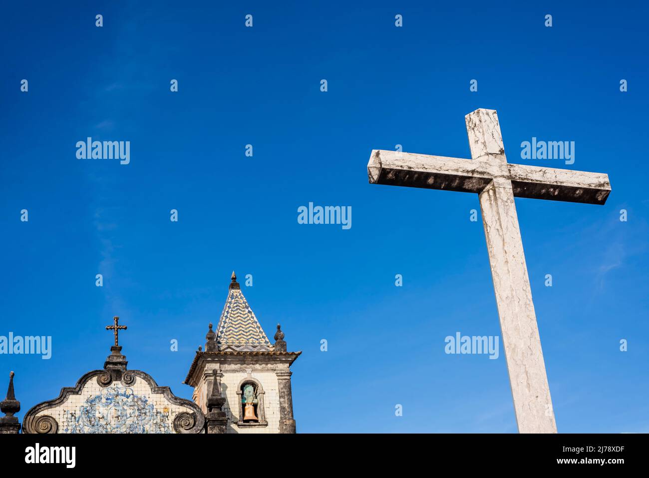 Cement cross of Boa Viagem church against blue sky. City of Salvador ...