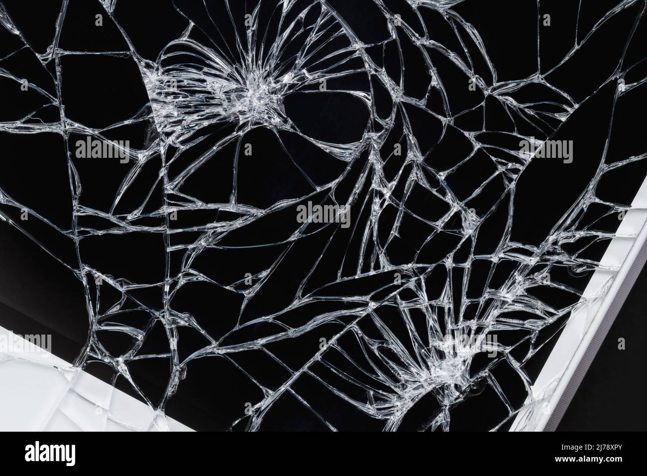 Broken display screen. Damaged smartphone glass. Closeup, dark ...