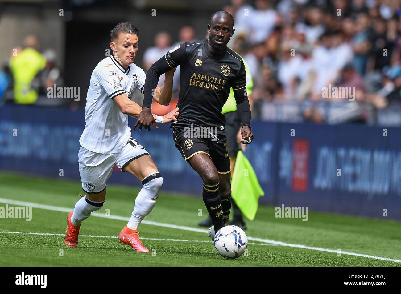Albert Adomah #37 of Queens Park Rangers under pressure from Hannes ...