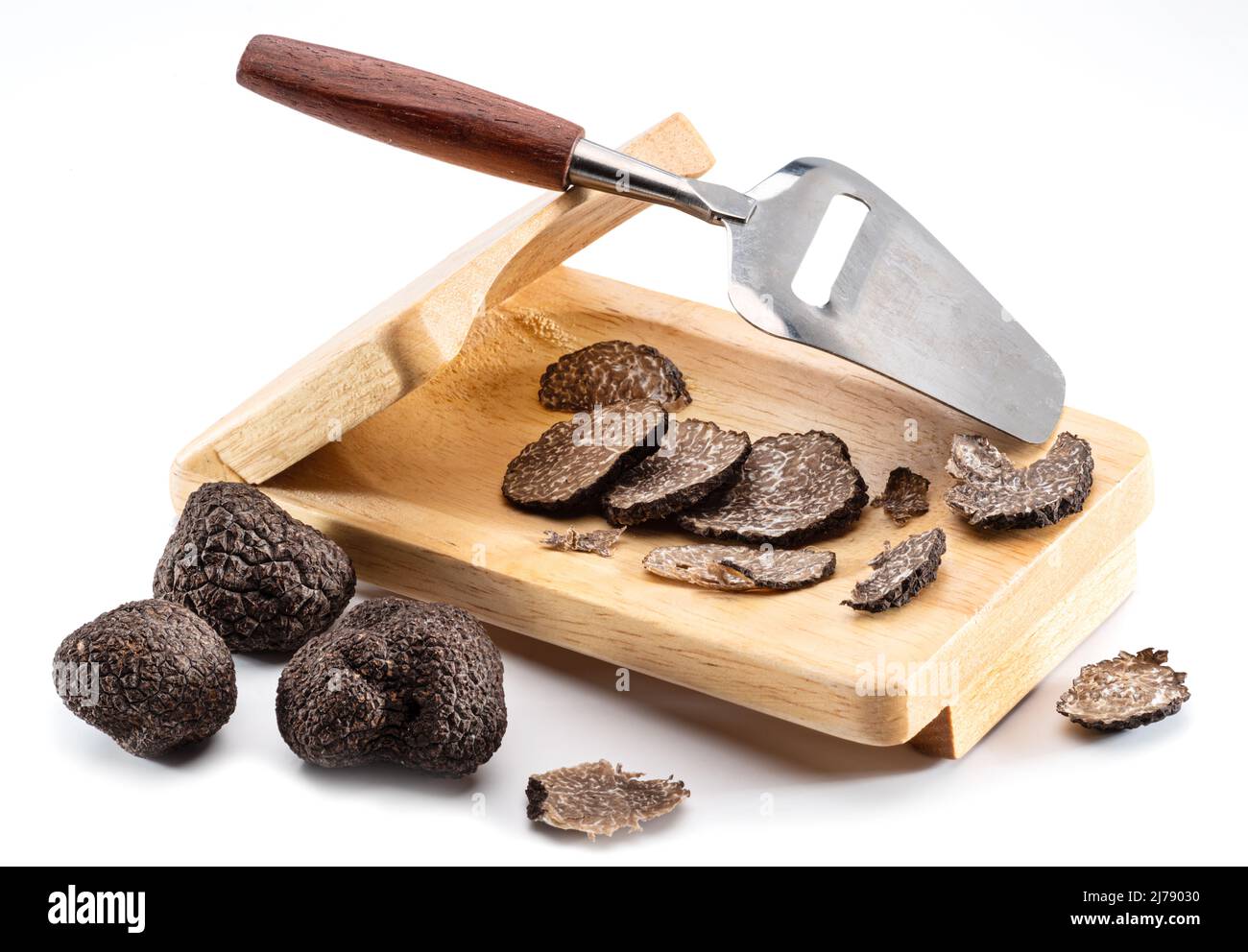 Black edible winter truffle on white background. The most famous of the ...