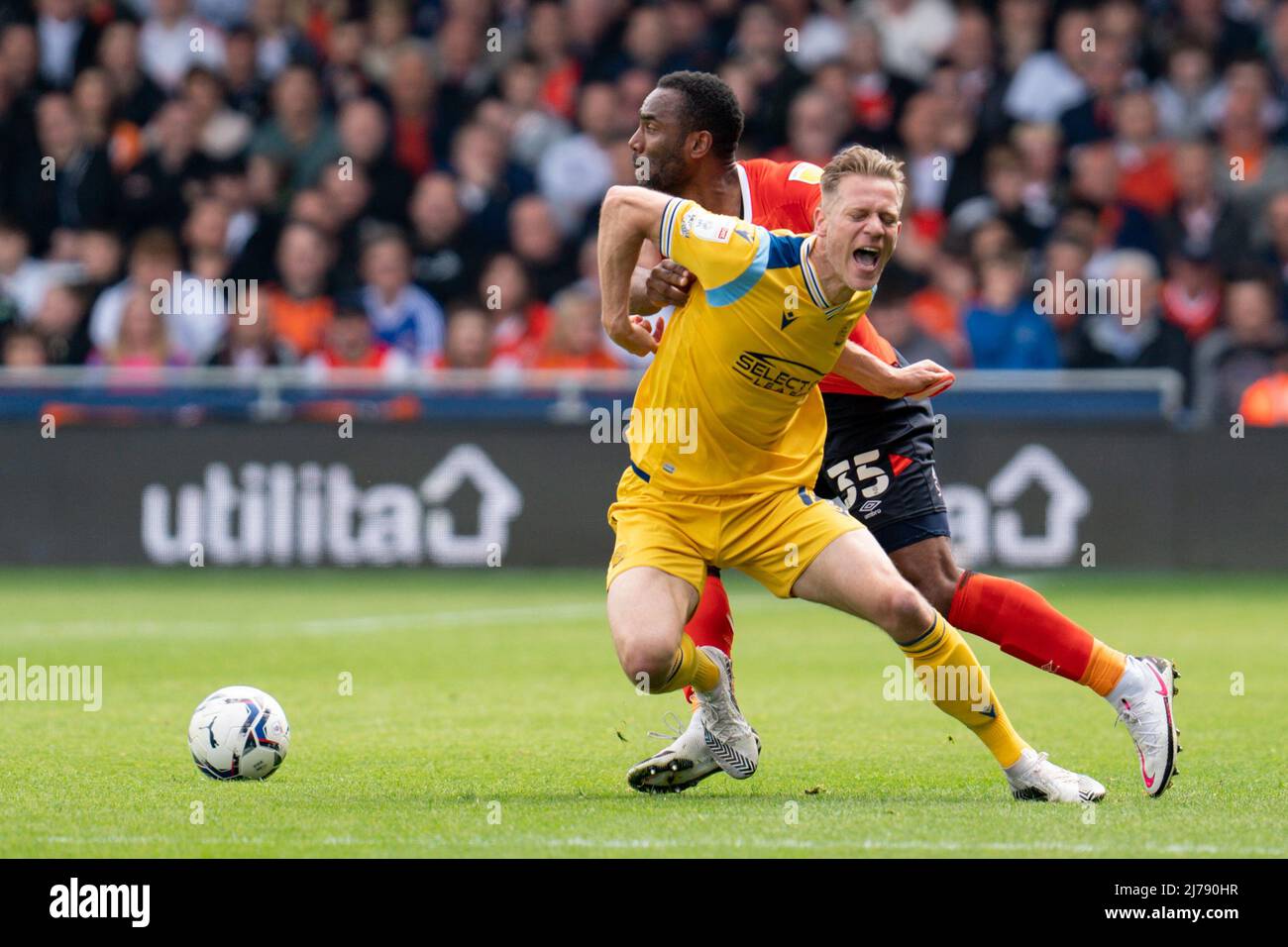Cameron Jerome #35 of Luton Town battle for the ball Michael Morrison ...