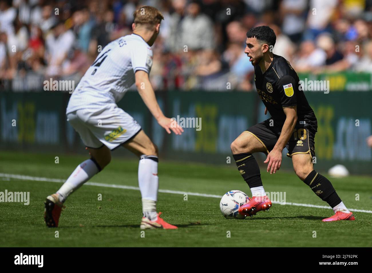 Ilias Chair #10 of Queens Park Rangers takes on Flynn Downes #4 of ...