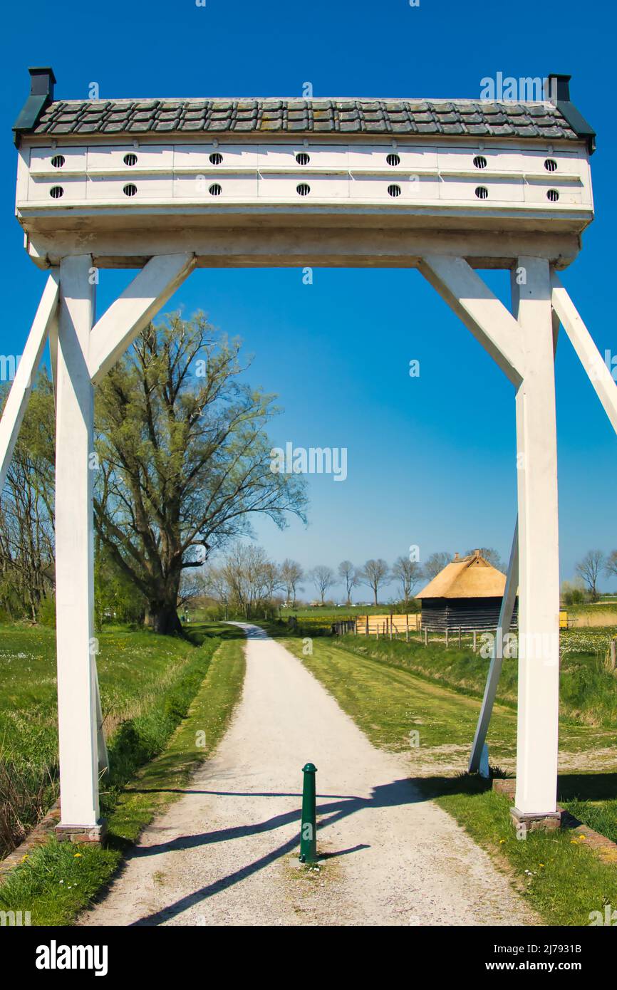 Wooden gate at the beginning of a footpath. The upper part of the gate ...