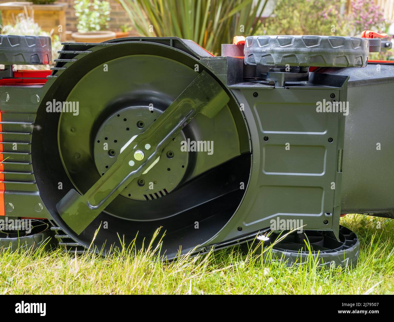 underside of a cordless lithium ion battery powered lawn mower exposing ...