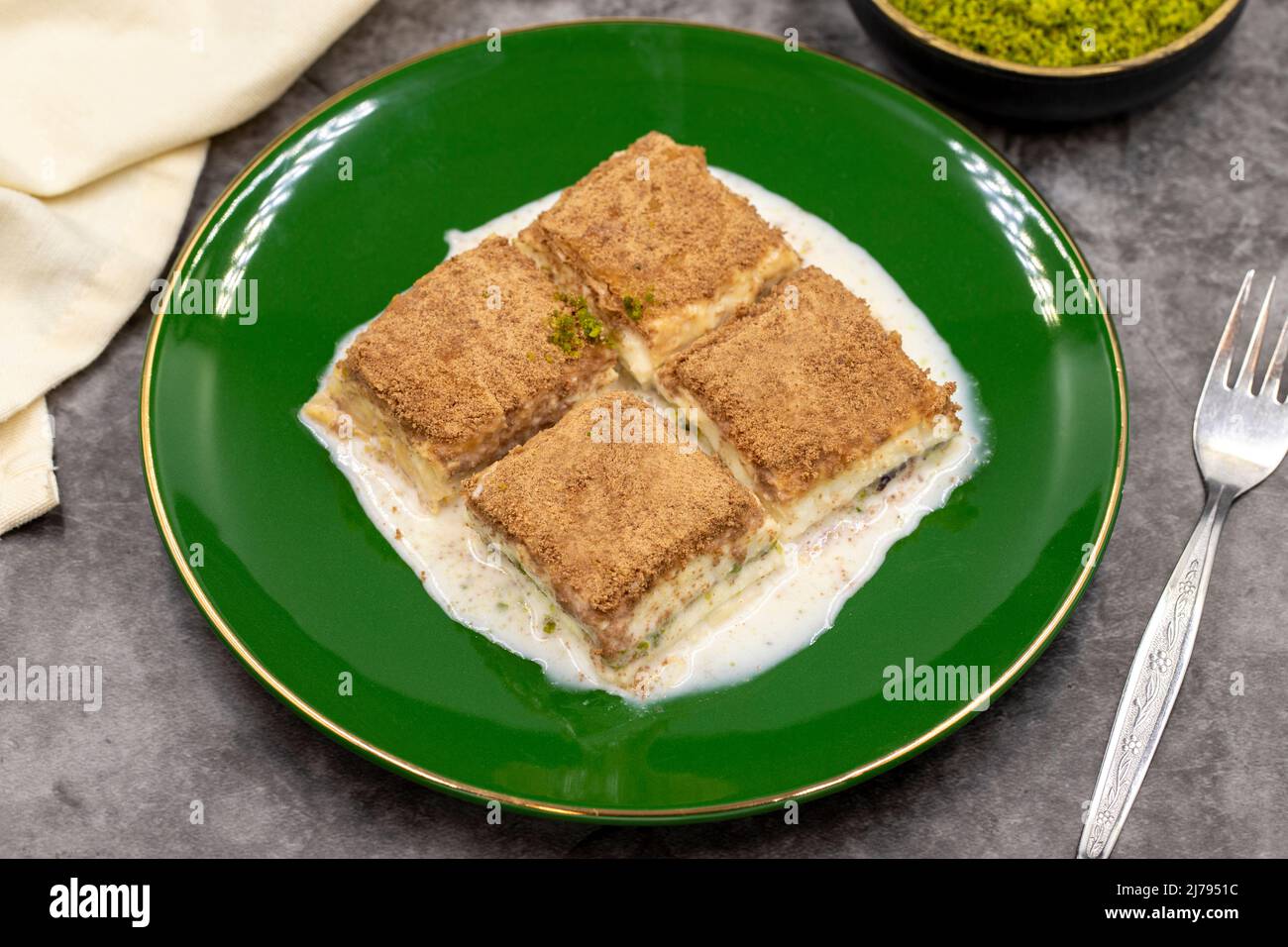 Cold baklava. Baklava with milk on a dark background. Mediterranean ...