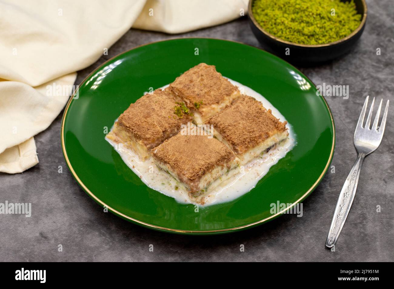 Cold baklava. Baklava with milk on a dark background. Mediterranean ...