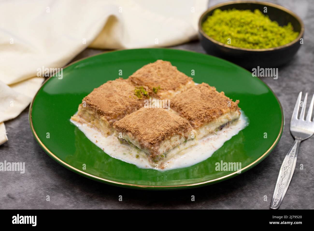 Cold baklava. Baklava with milk on a dark background. Mediterranean ...