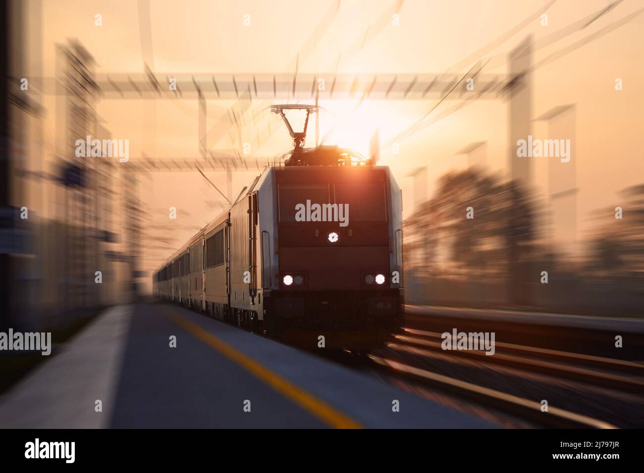 Passenger train fast passing through railroad station. Railway at ...