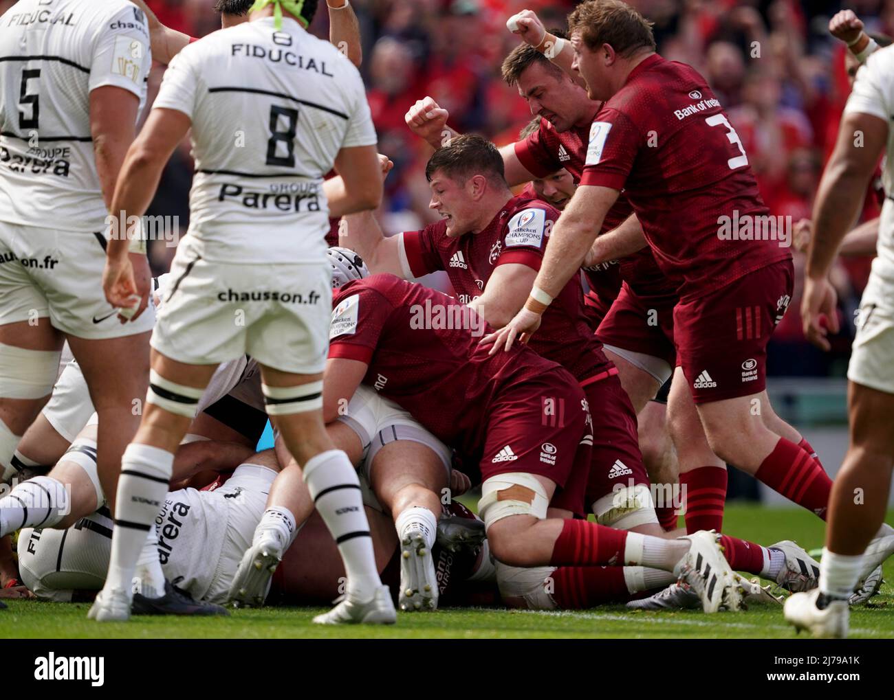 Munster's players celebrate Alex Kendellen's (not pictured) try during ...