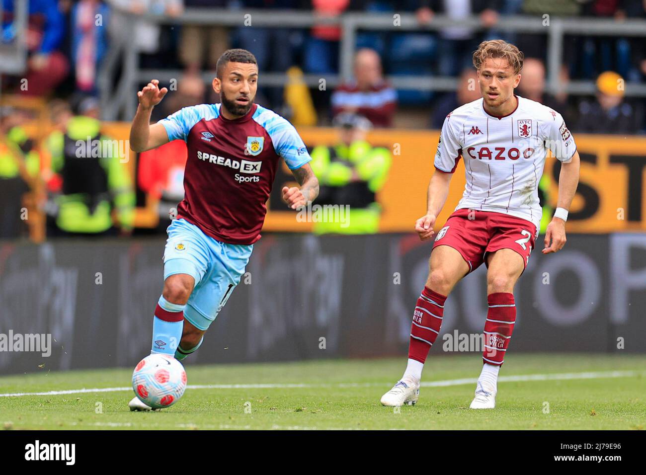 Aaron Lennon #17 of Burnley runs with the ball watched by Matty Cash #2 ...