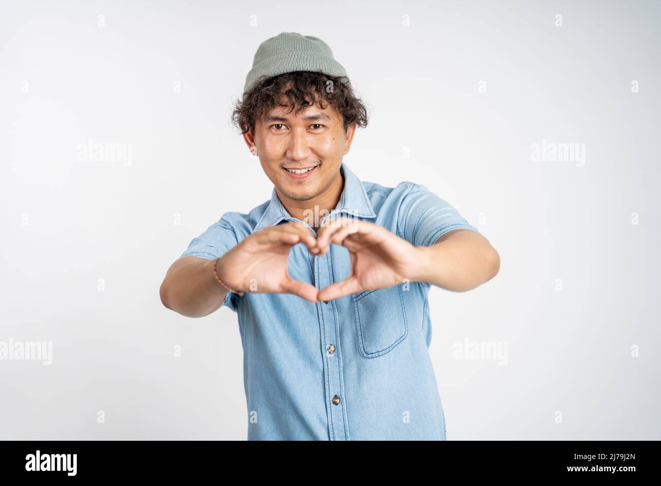 man forming a heart with finger gestures on isolated background Stock ...