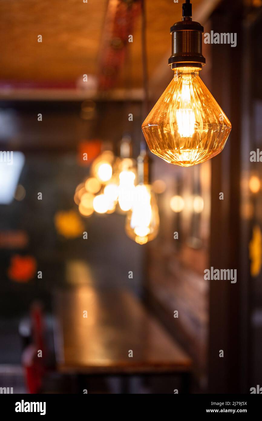 retro light bulb with warm light in a cafe Stock Photo - Alamy