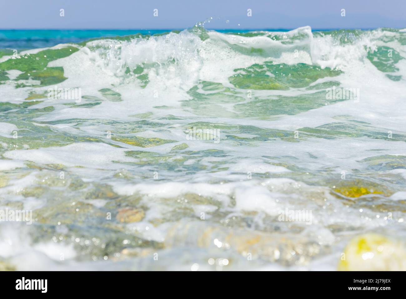 Turquoise sea and blue sky. Landscape with sea waves at a summer resort ...