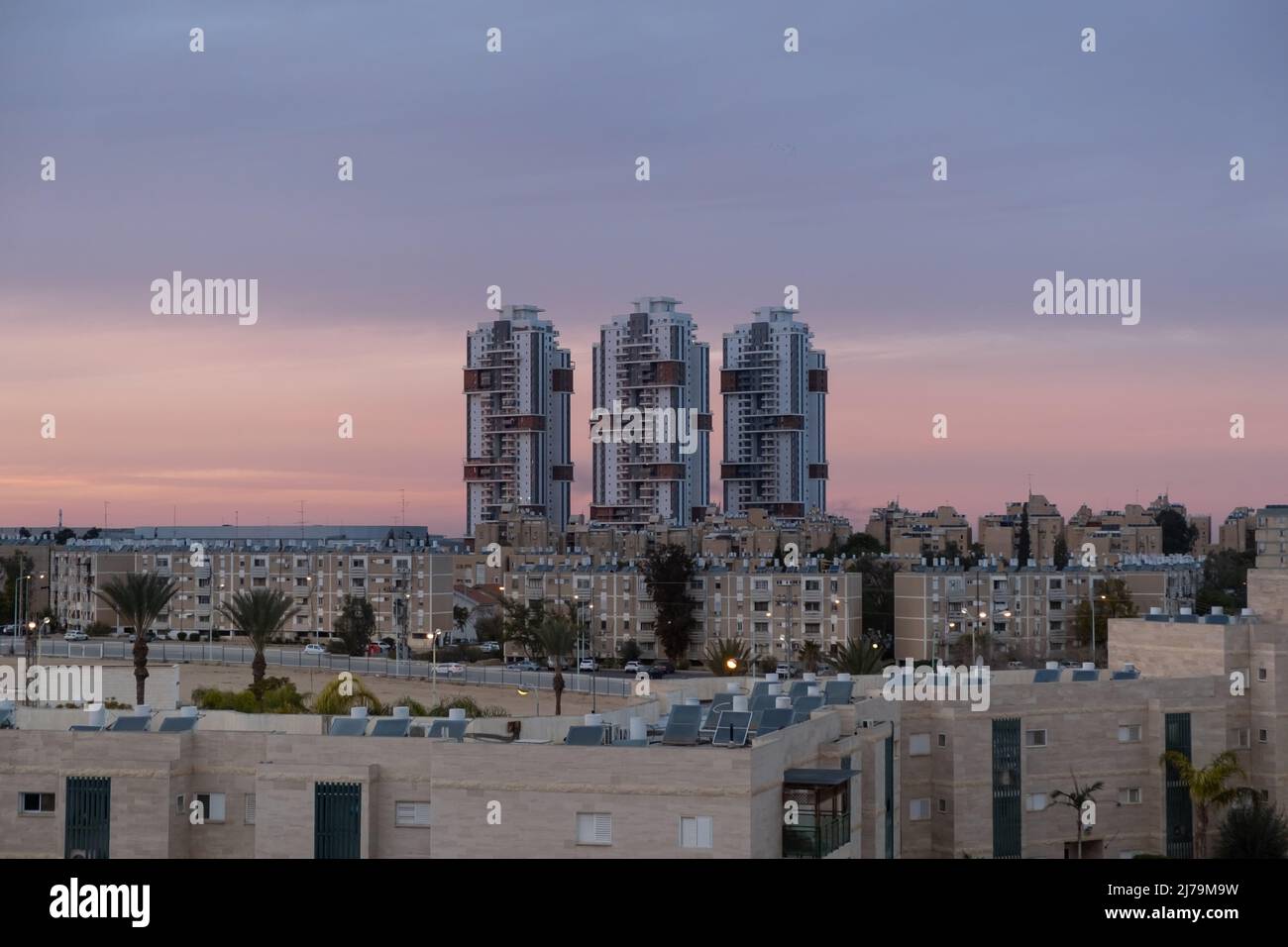 Dusk in the south of Israel. Contrast Architecture in the city, modern ...